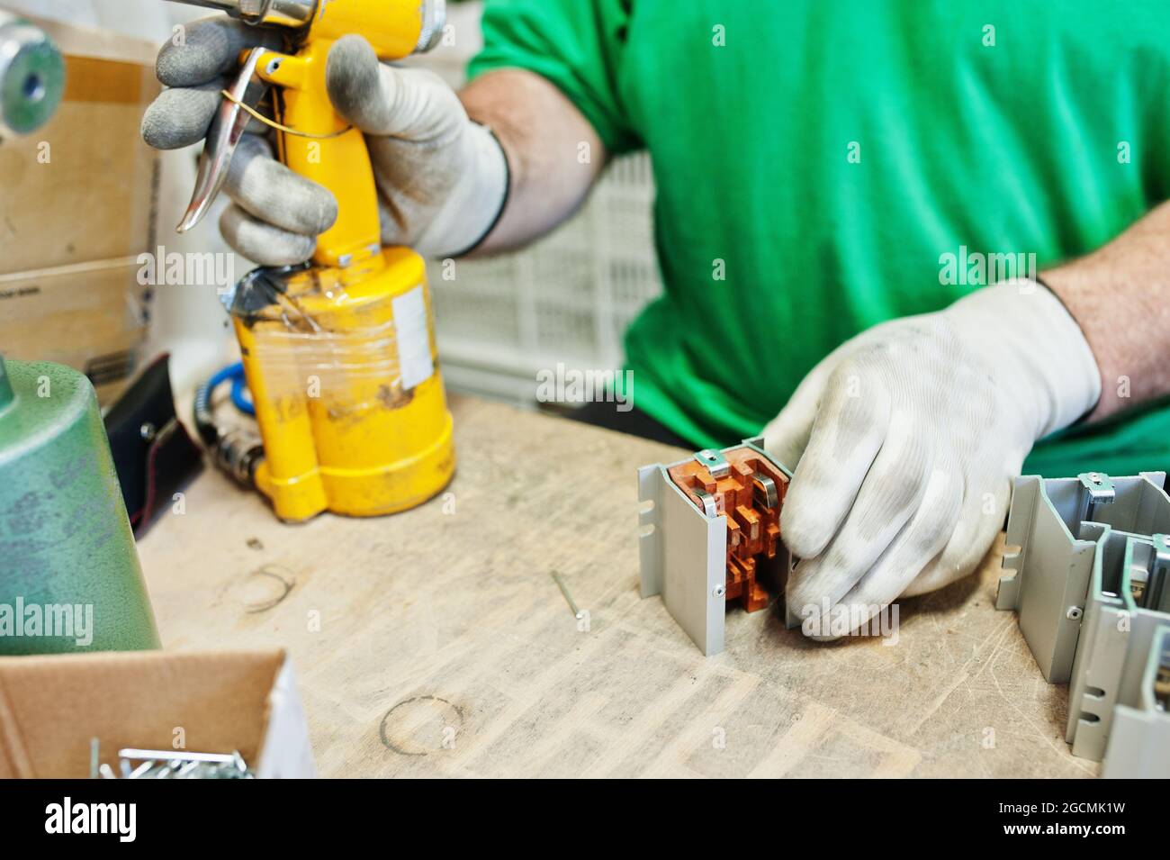 Man worker hold screwdriver machine and use it Stock Photo - Alamy