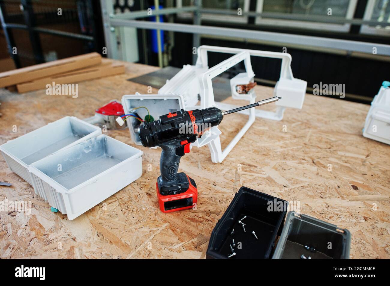 Screwdriver machine at table in factory plant Stock Photo - Alamy