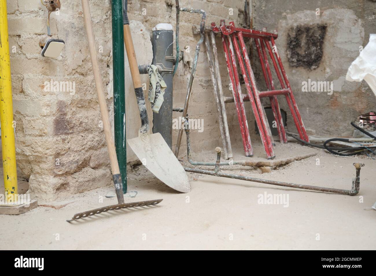 Rake, shovel, scaffold, pipes, switch and first pillar at a ...