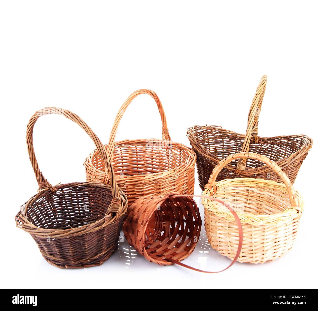 Empty wicker baskets, isolated on white Stock Photo - Alamy