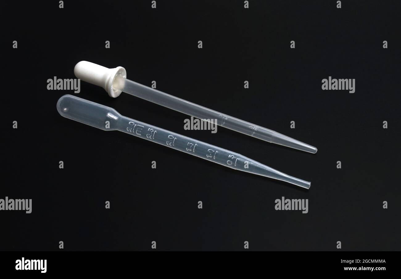 Microscope hands scientist dropper hi-res stock photography and images ...