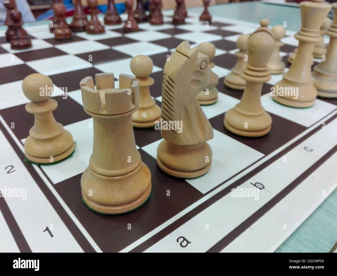 Wooden chess figurines on a chess table Stock Photo - Alamy