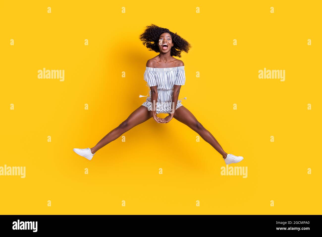 Full length body size view of attractive cheerful crazy ecstatic fit girl jumping having fun ...