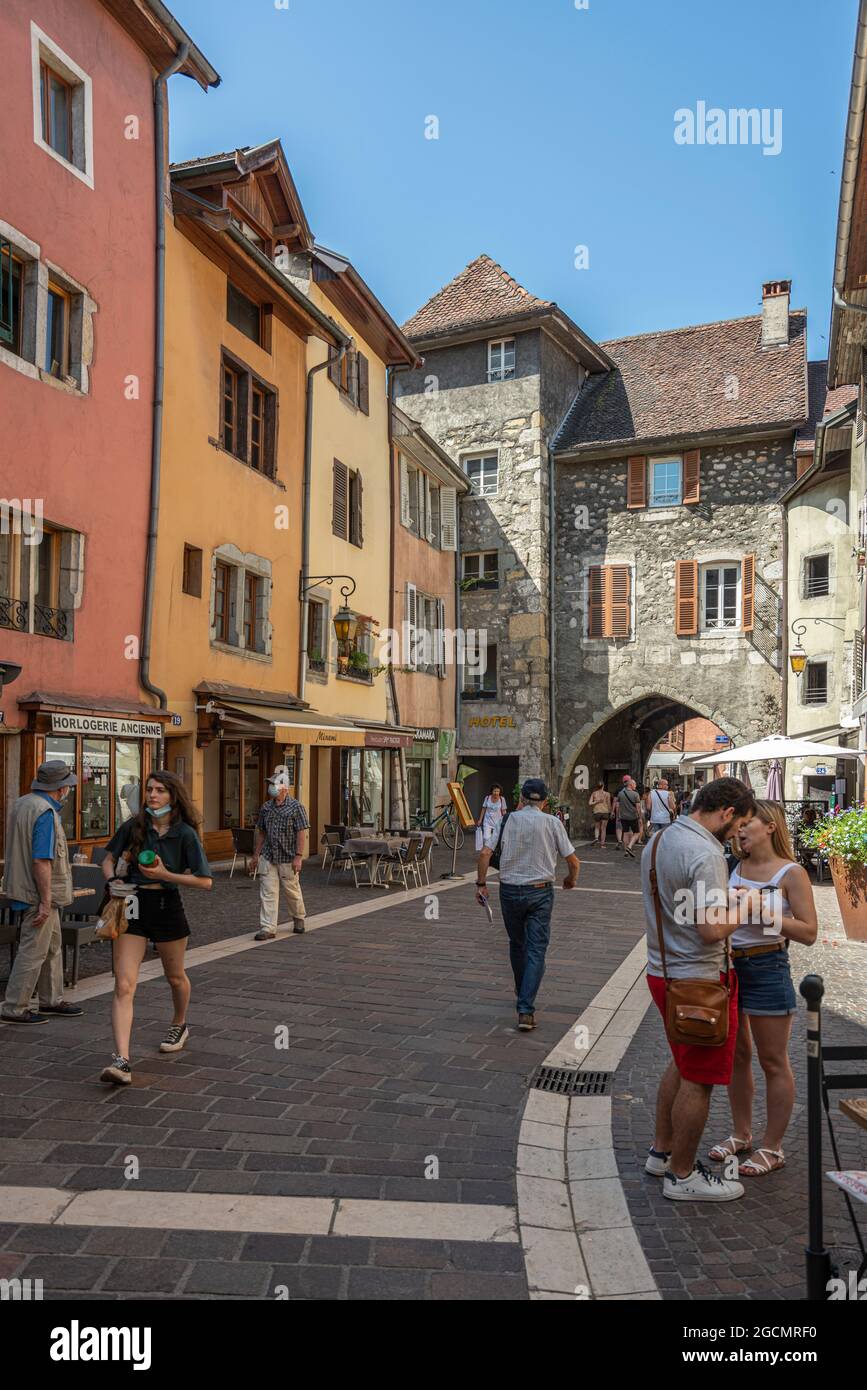 Tourists strolling through the ancient streets of the old town of ...