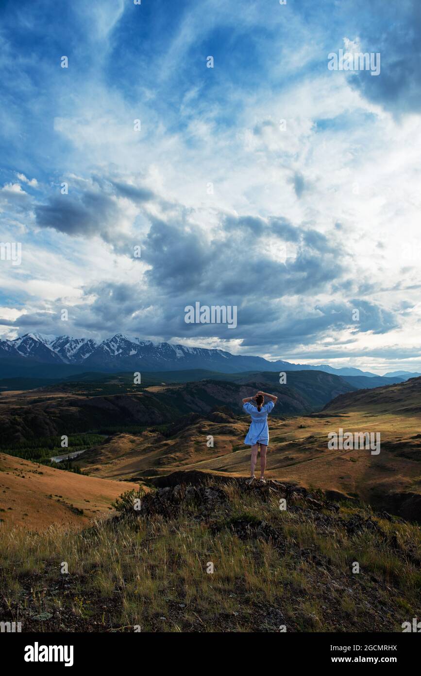 Woman in blue dress in summer Altai mountains in Kurai steppe Stock ...