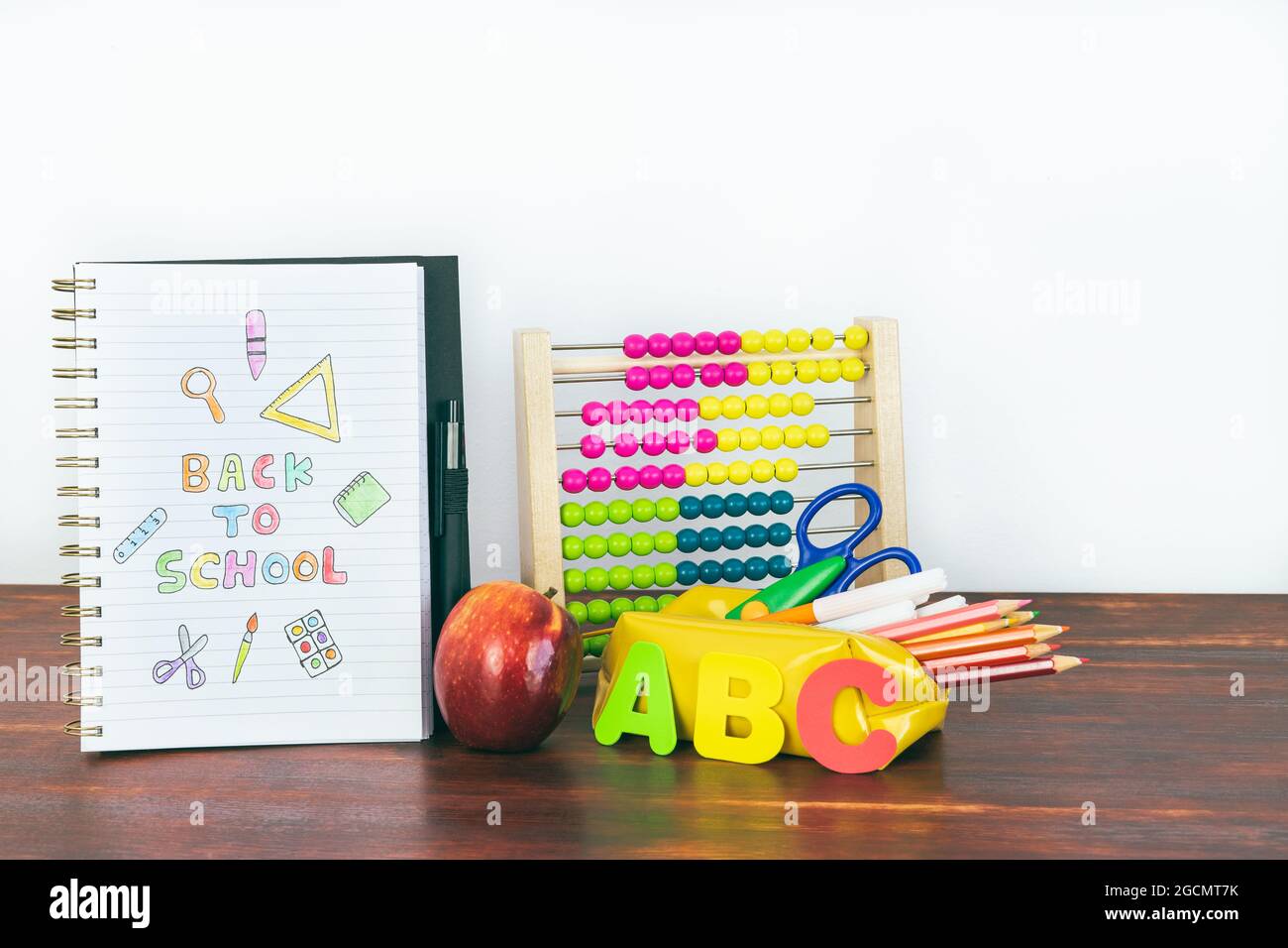 Notebook with back-to-school drawing. School material with abacus ...