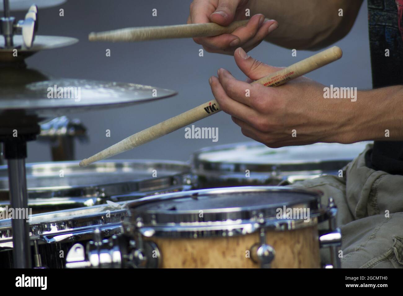 Close up of a male hand playing drums with wooden sticks Stock Photo ...