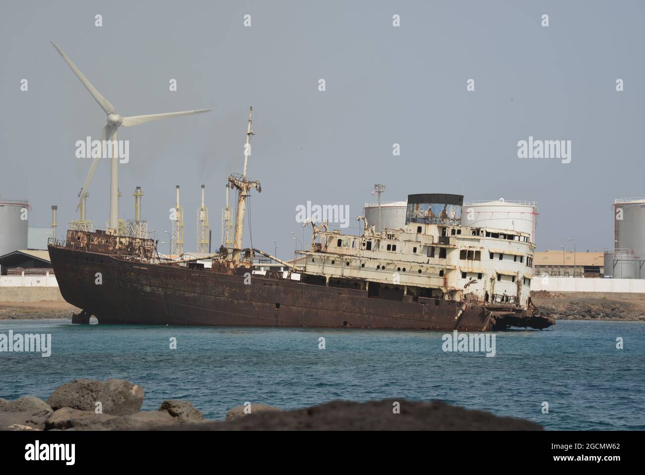Scenic view of an old and rustic ship near a shore under a clear sky ...