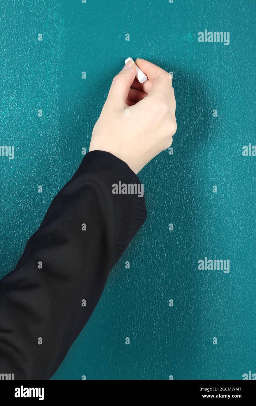 Hand writing on blackboard in class room Stock Photo - Alamy