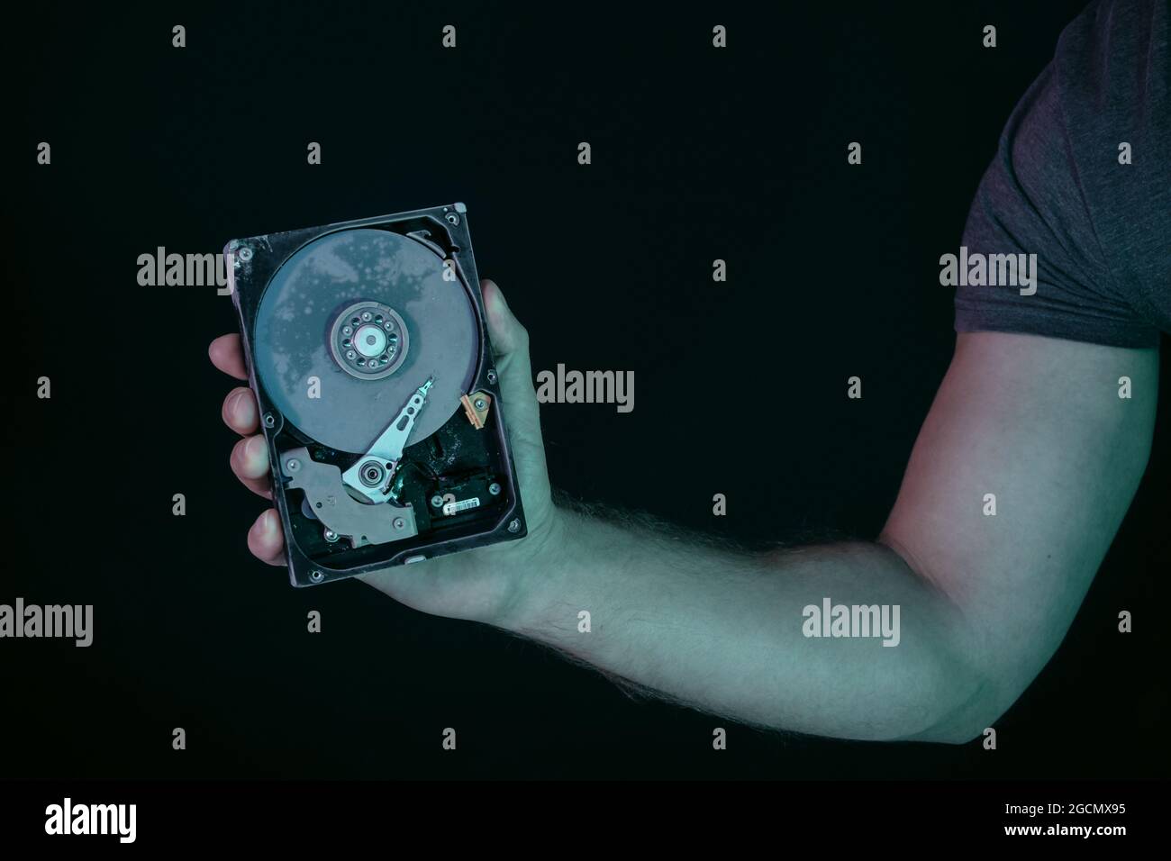 Hand holding open detail frozen hard disk. Concept protection ...