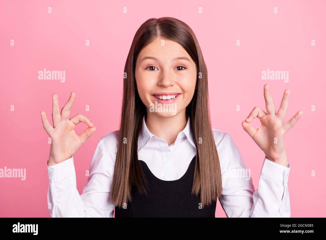 Photo of cheerful young happy small little girl show okay sign good ...