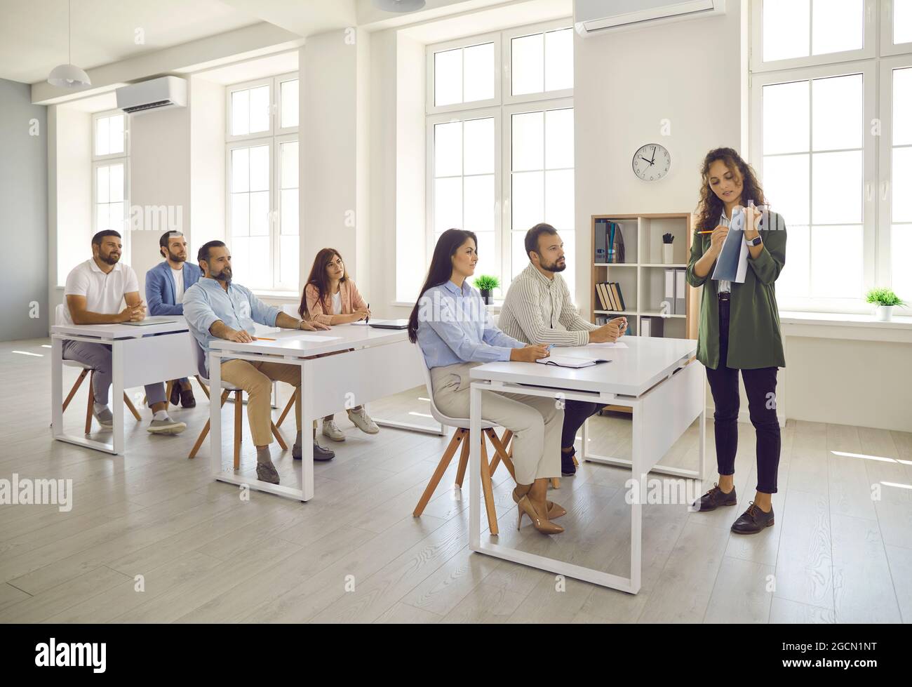 Experienced female business coach explains the strategy of a marketing ...