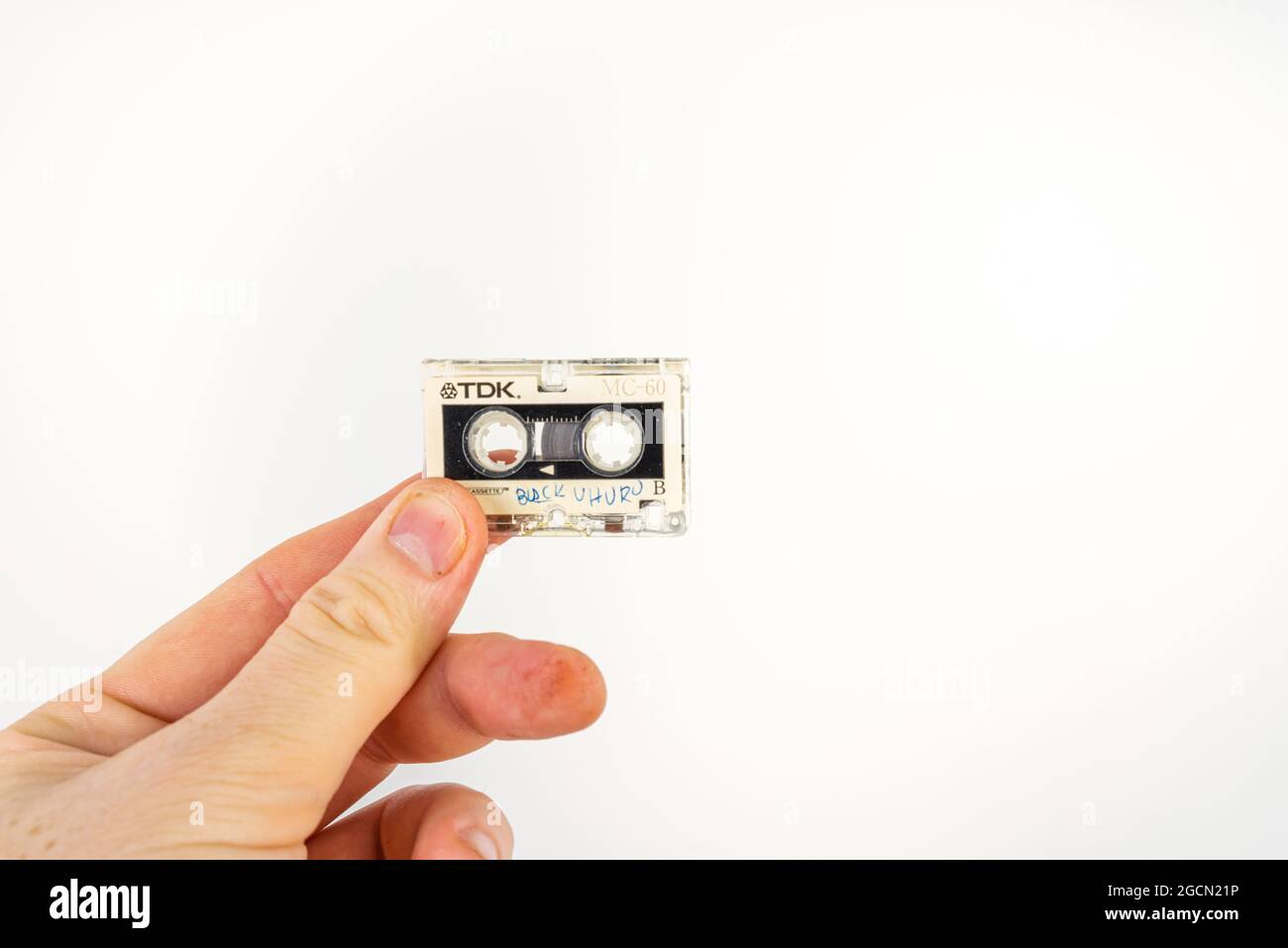 MILAN, ITALY - Jul 15, 2021: A hand holding a vintage audio micro ...