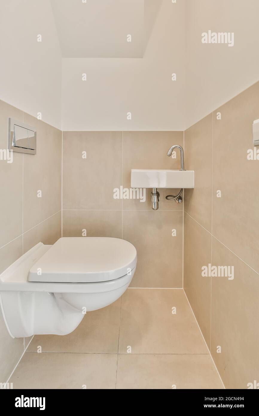 Interior of small clean washroom in miniature style Stock Photo - Alamy
