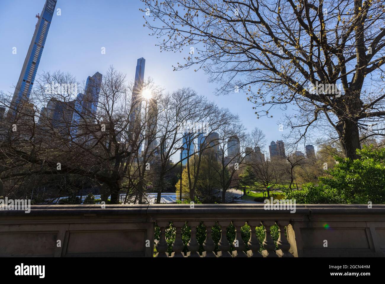 The sun shines from among Midtown Manhattan Skyscraper Central Park NYC ...