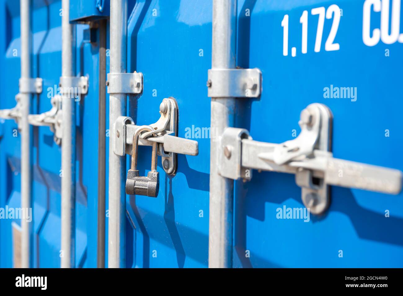 Container close-up. Blue cargo container with a lock. The concept of ...