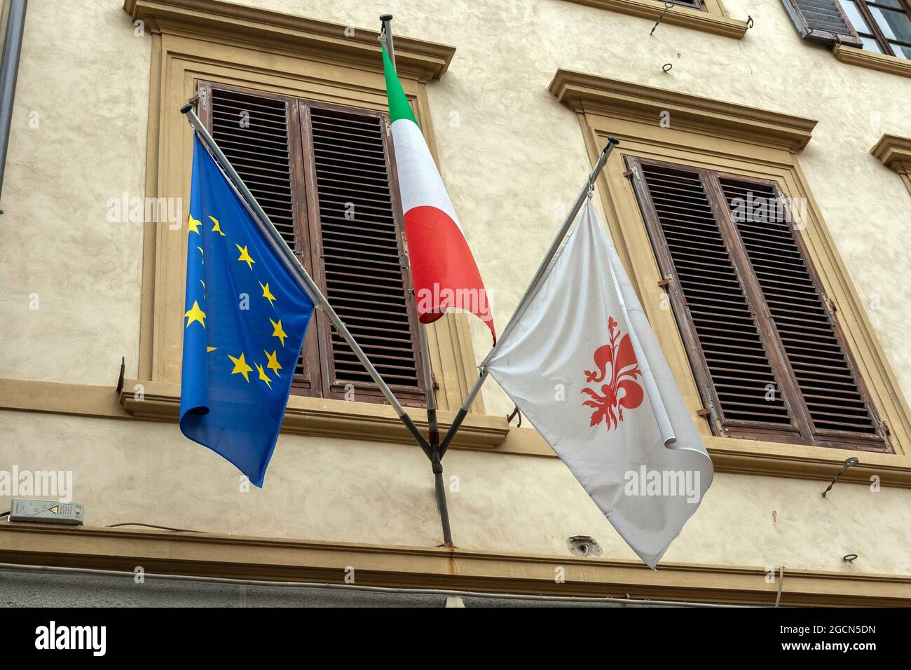 Flags of the European union, Italy and Florence on a building in ...
