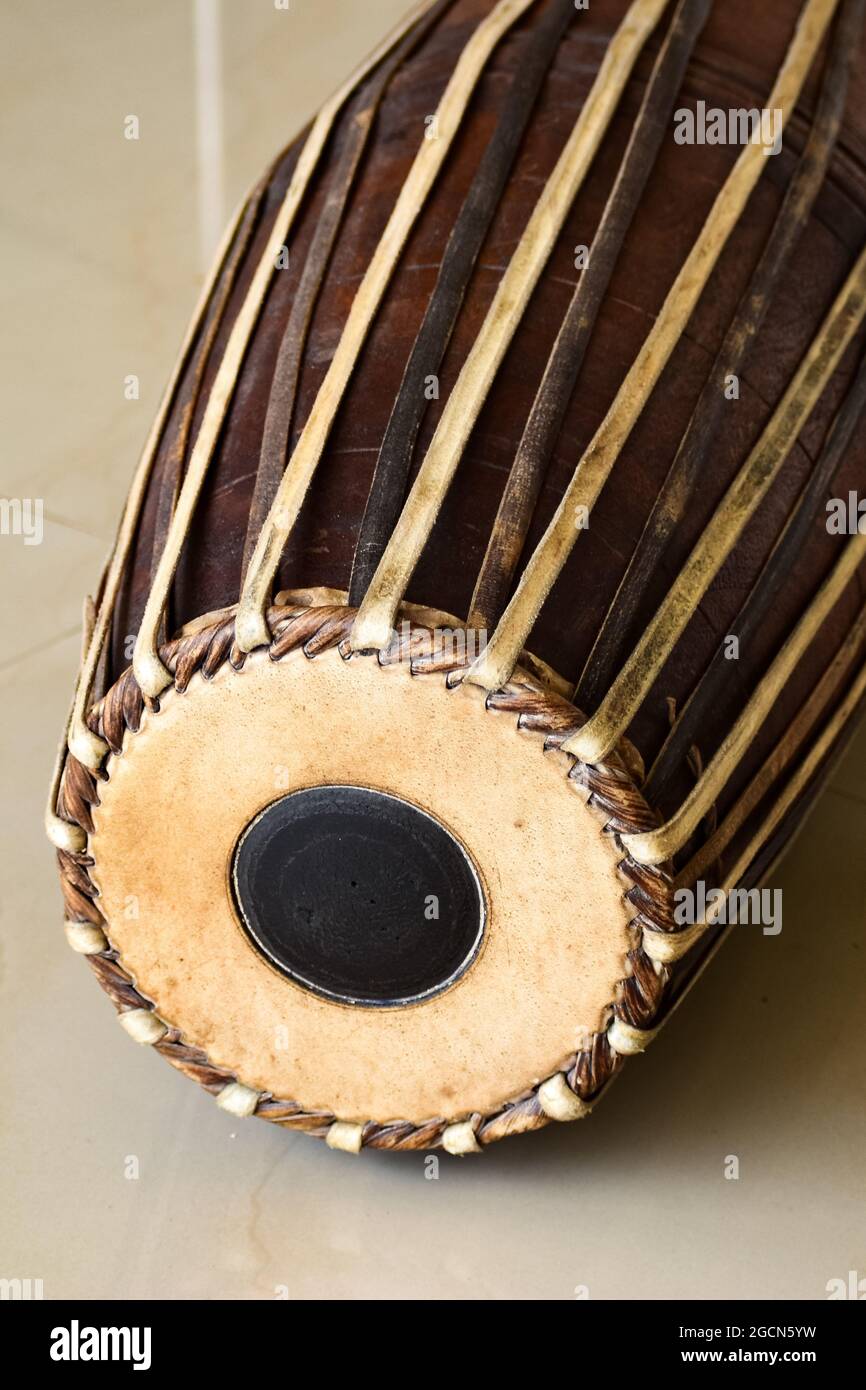Vertical shot of a bongo instrument with leather stripes Stock Photo ...