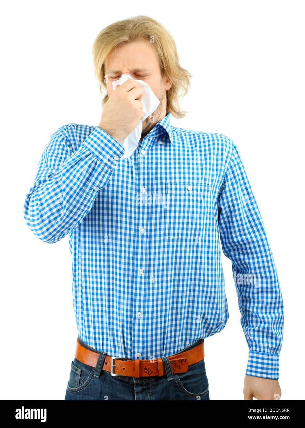 Sneezing young man isolated on white Stock Photo - Alamy