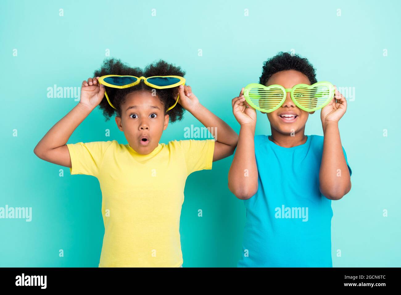 Portrait of two amazed cheerful friends friendship wearing specs good ...