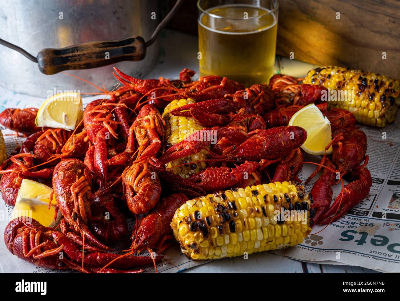 Steamed crawfish with grilled corn and beer Stock Photo - Alamy