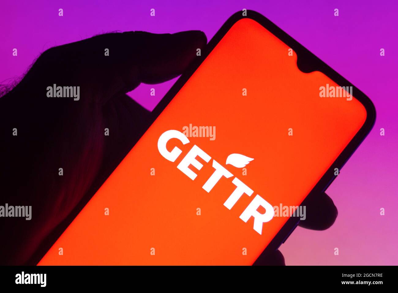 In this photo illustration, the Gettr logo seen displayed on a ...