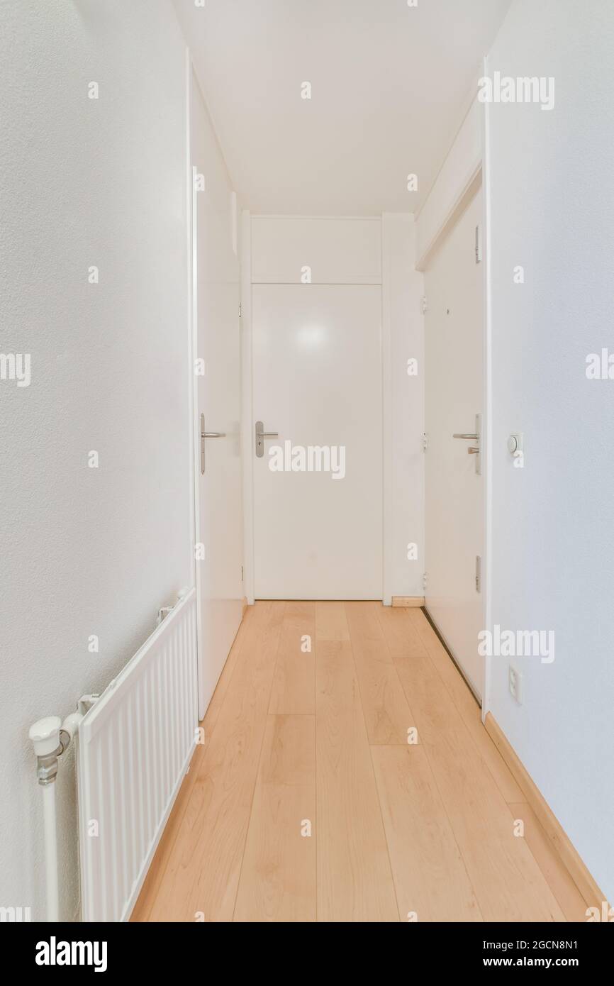 A long empty corridor designed in minimalistic style Stock Photo - Alamy