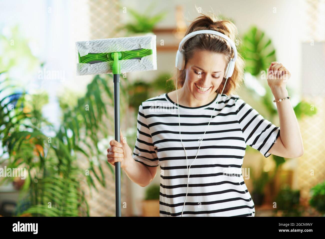 Mature woman doing housework hi-res stock photography and images - Alamy
