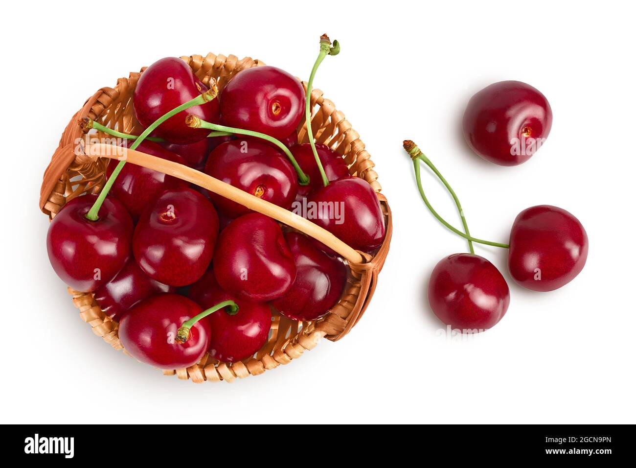 red sweet cherry in wicker basket isolated on white background with ...