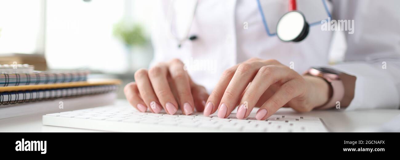 Doctor hands on white keyboard. Getting medical education Stock Photo ...