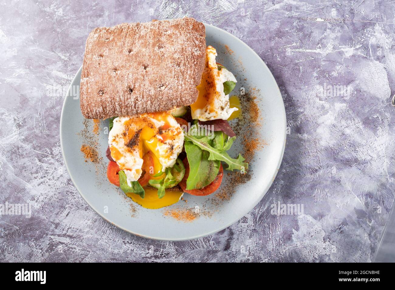 Sandwich with square bread. Poached eggs in a square bun. Flat lay. Top ...