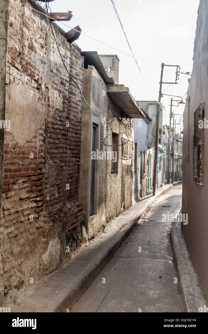 Narrow alley in Camaguey town, Cuba Stock Photo - Alamy