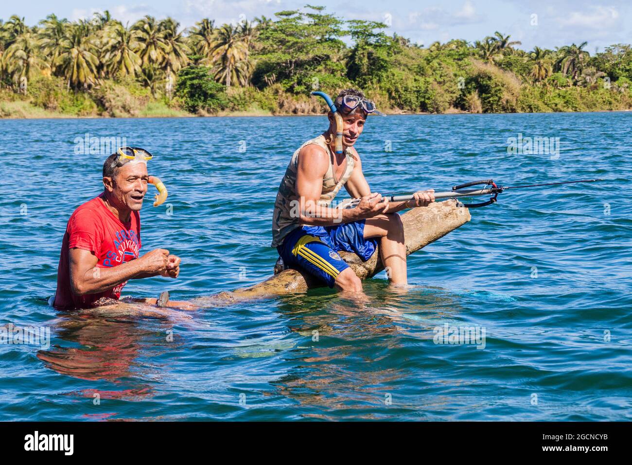 BARACOA, CUBA - FEB 5, 2016: Fishermen at the mouth of Rio Toa river ...