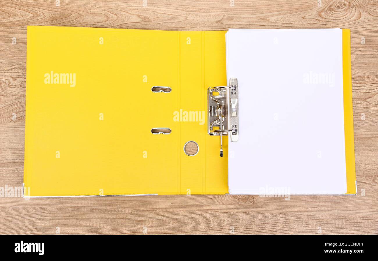 Open file folder on desk Stock Photo - Alamy