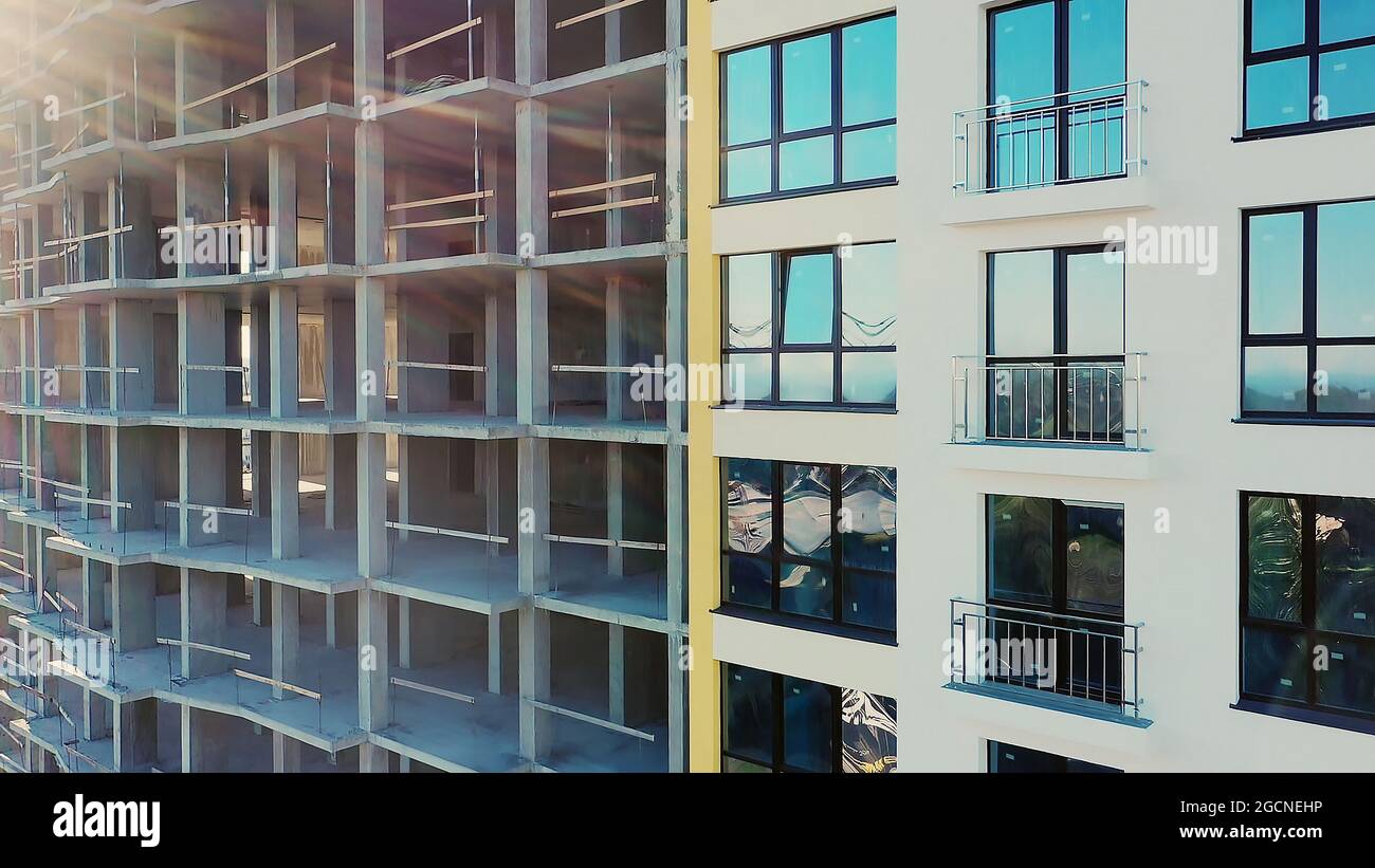 Many windows on new apartment building facade under construction. Real ...