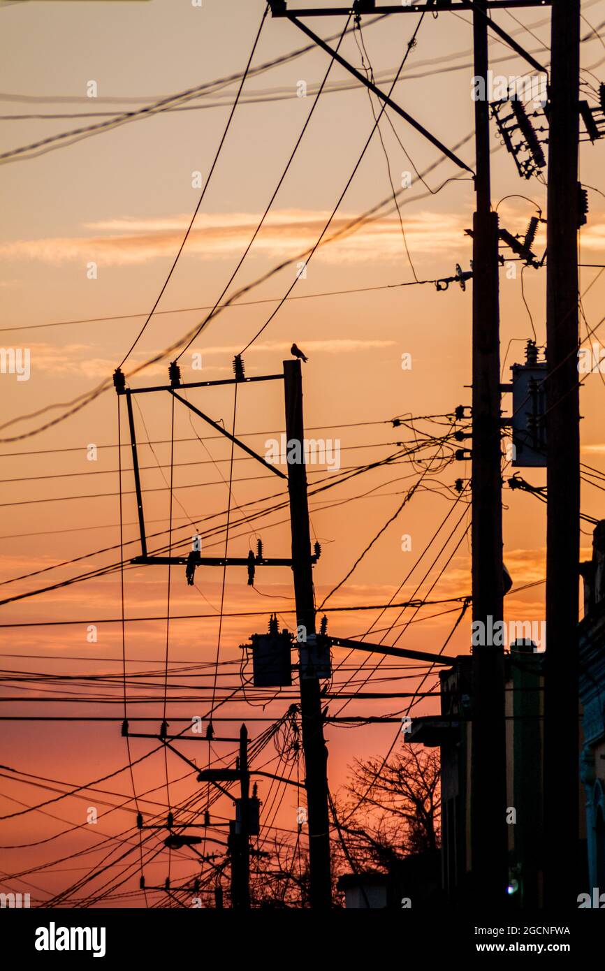 Mess of wires during the sunset. Las Tunas, Cuba Stock Photo - Alamy