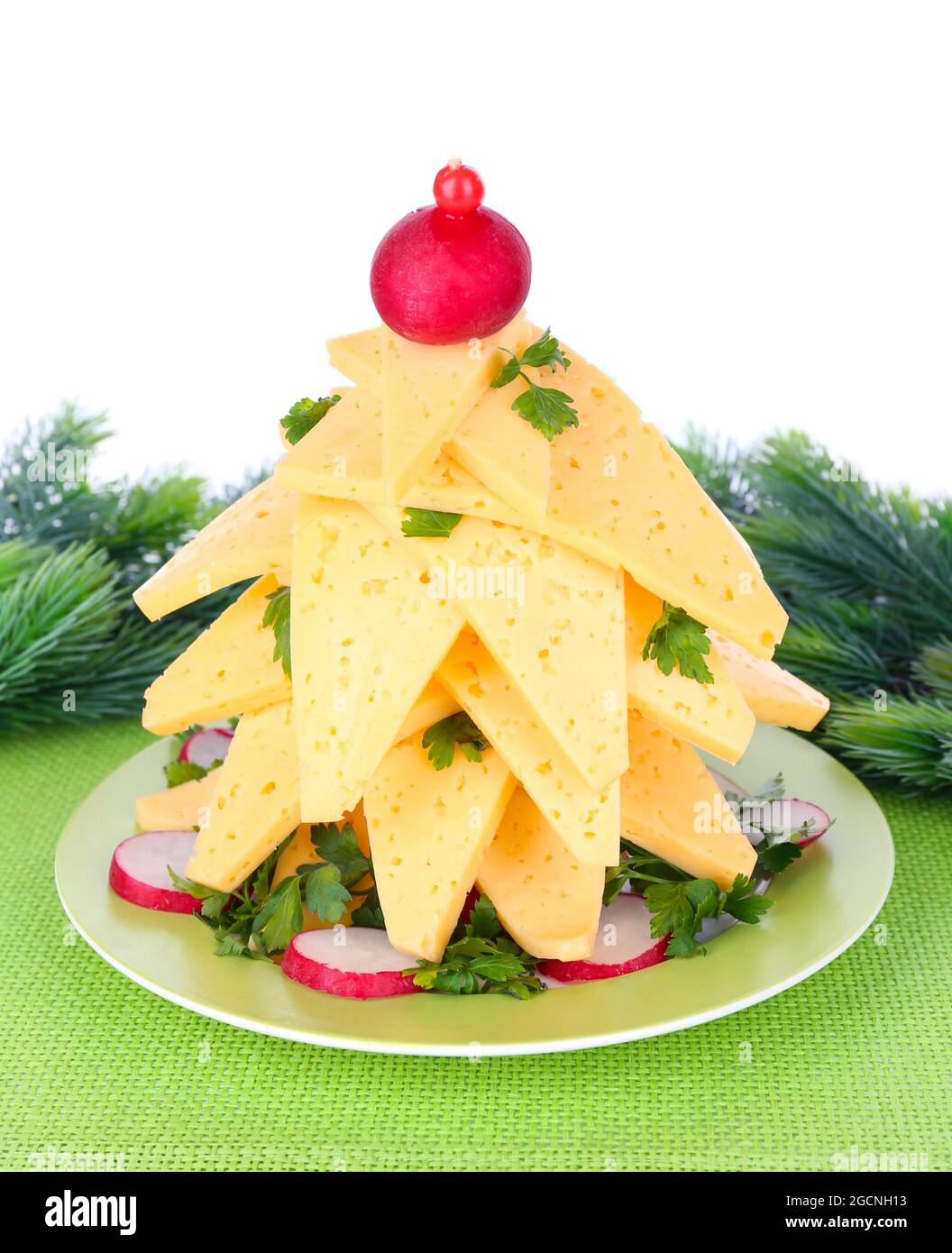 Christmas tree from cheese on table on white background Stock Photo - Alamy