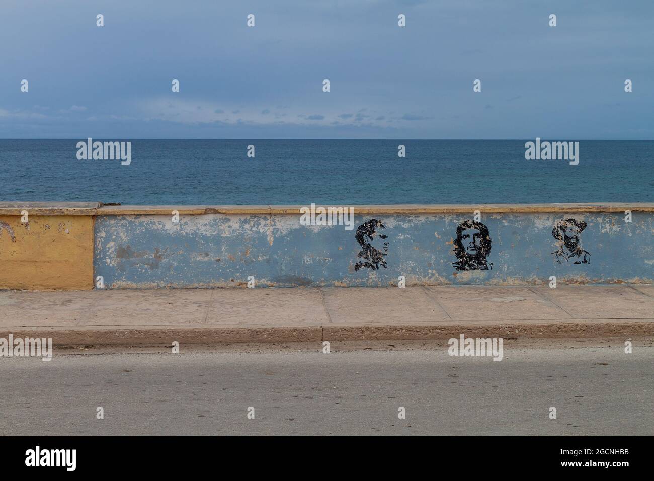 Waterfront in Gibara village, Cuba. Portraits of Julio Antonio Mella ...