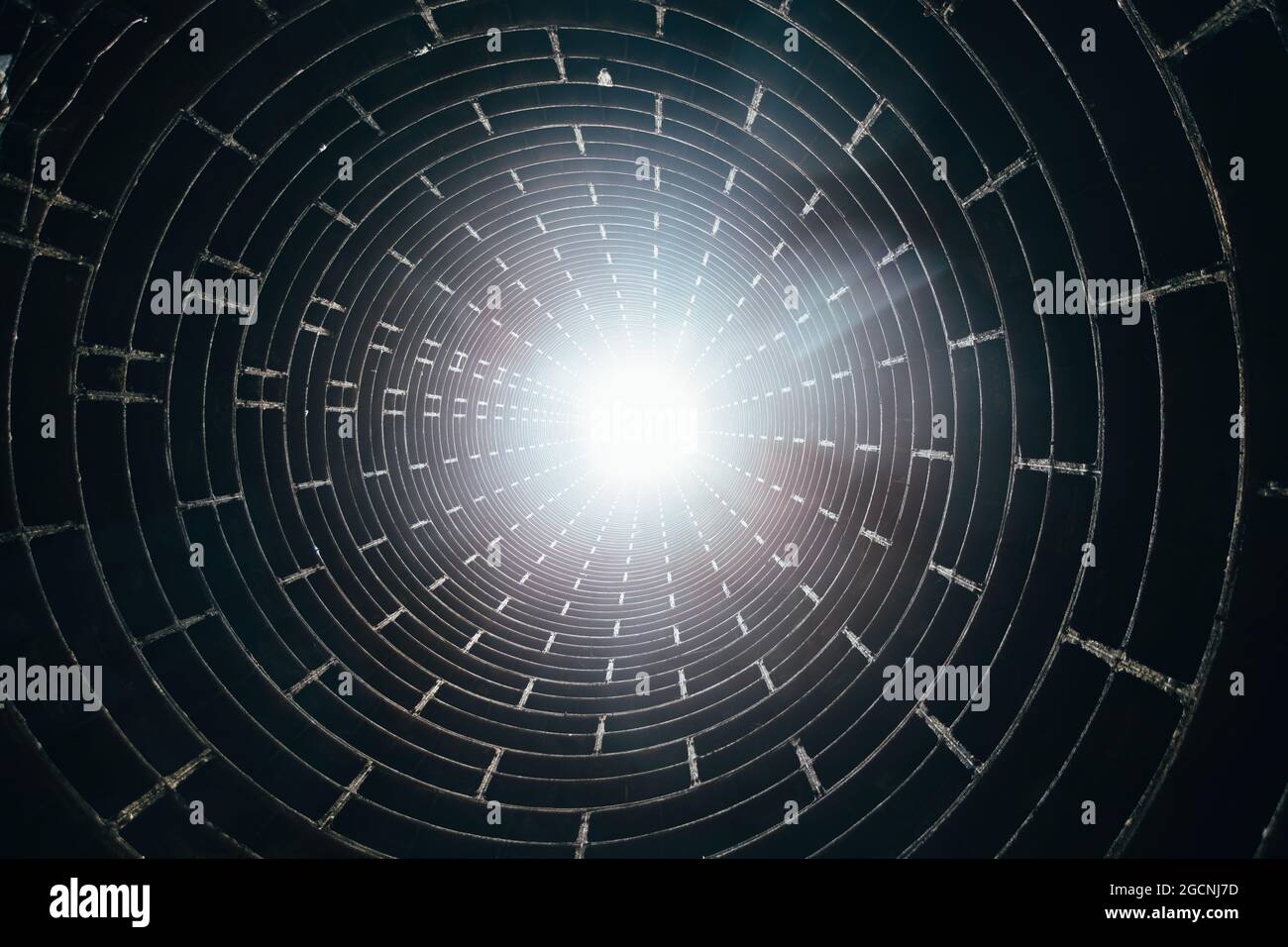 Vertical tubing shaft. Abstract light at the end of tube tunnel Stock ...