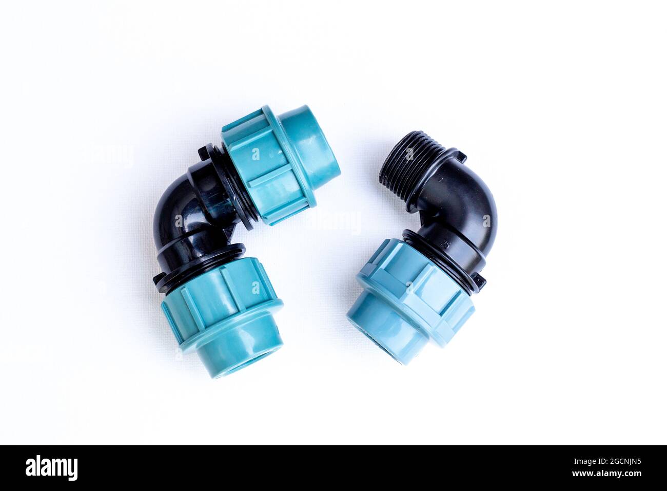 Black coupling for connecting plastic pipes on a white background ...