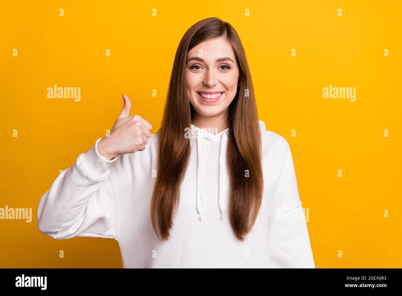 Photo of cheerful young happy positive lady make thumb up recommend ...