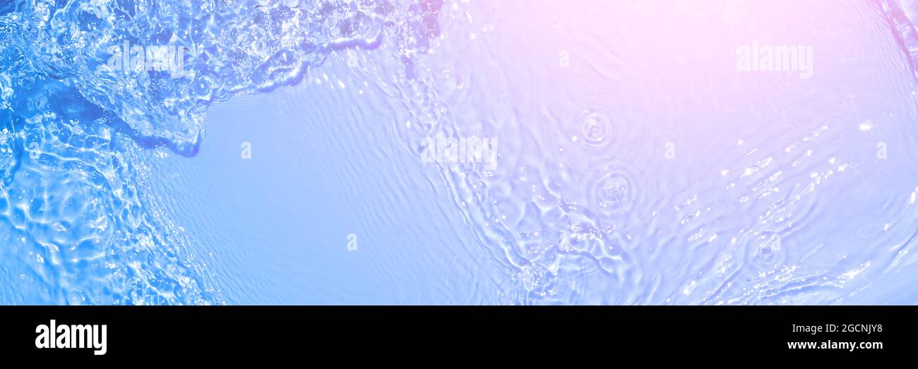 Serum texture close up. Light blue and pink gradient liquid gel ...
