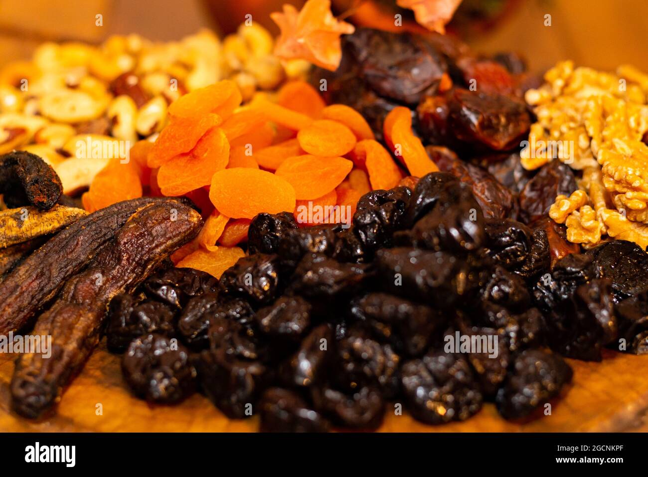 A mix of dehydrated nuts and fruits, arranged, ready for consumption ...