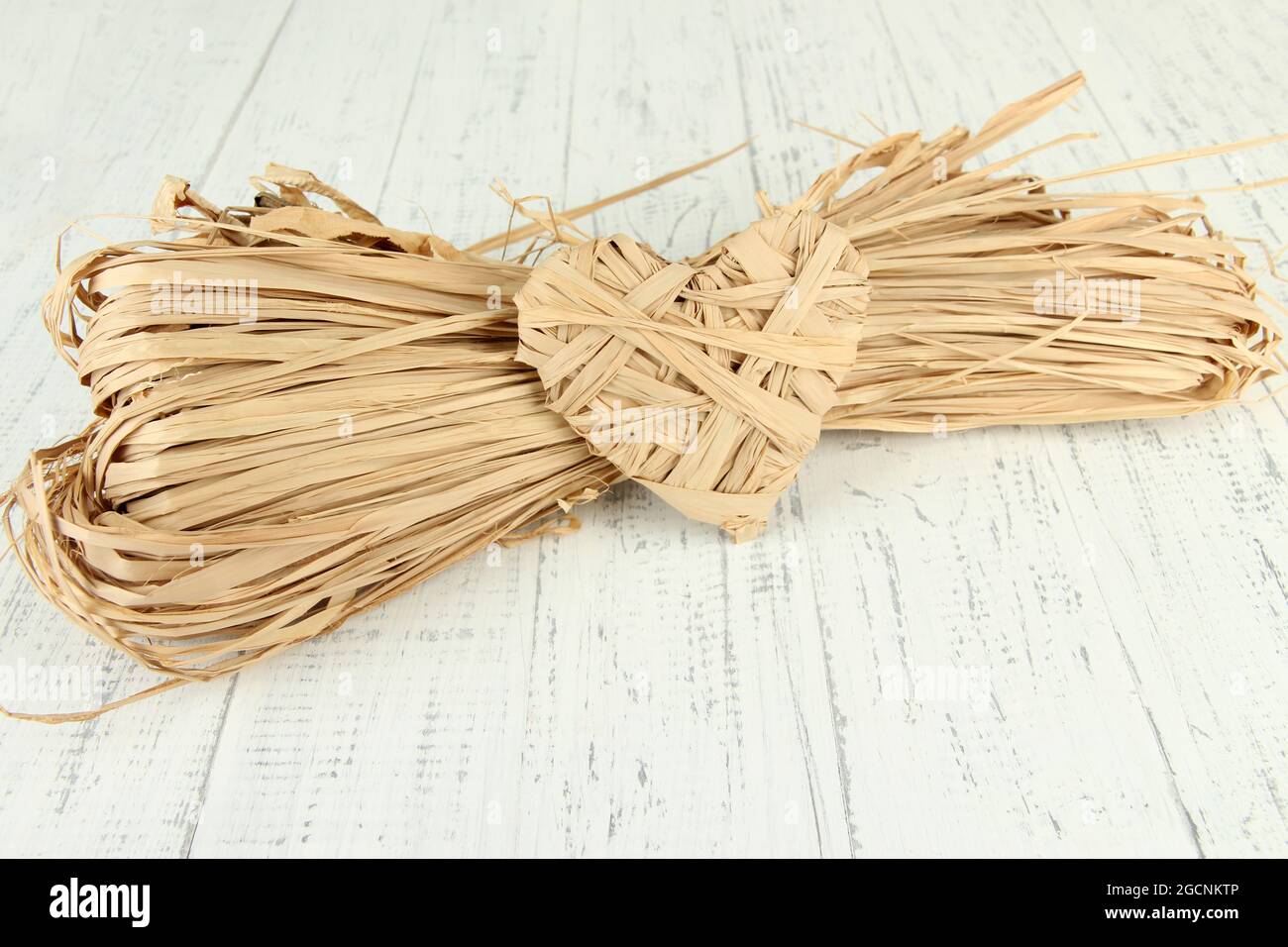 Decorative straw for hand made and heart of straw, on wooden background ...