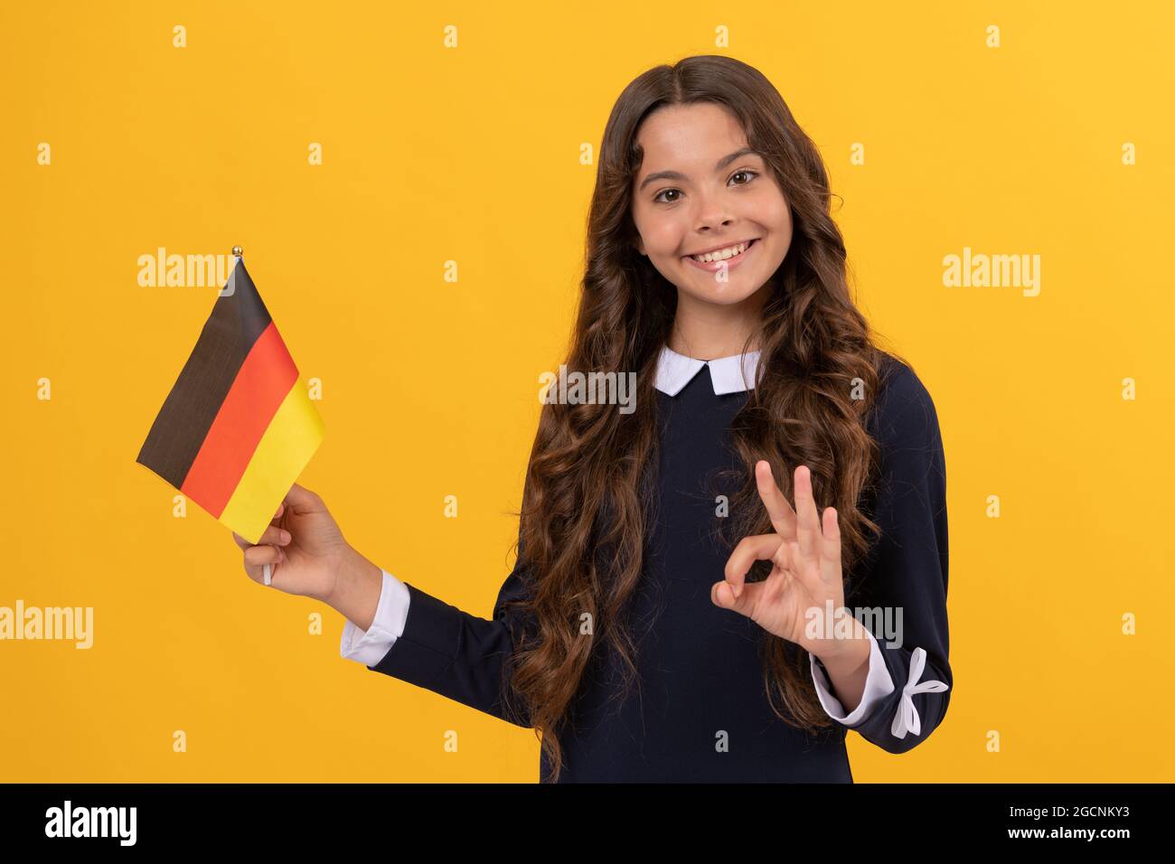 ok gesture. happy child holding german flag. touristic visa in schengen ...