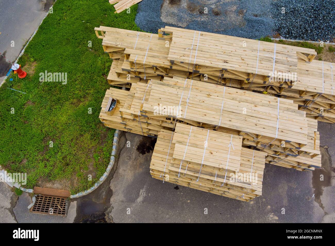 View of on stacker wooden material boards and beams for new house on of ...