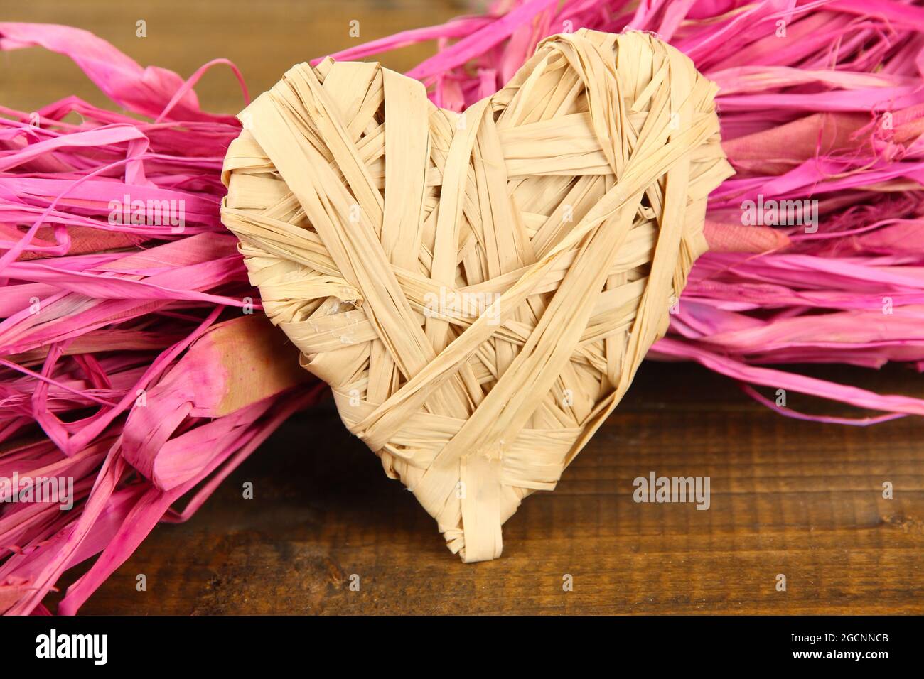 Decorative straw for hand made and heart of straw, on wooden background ...
