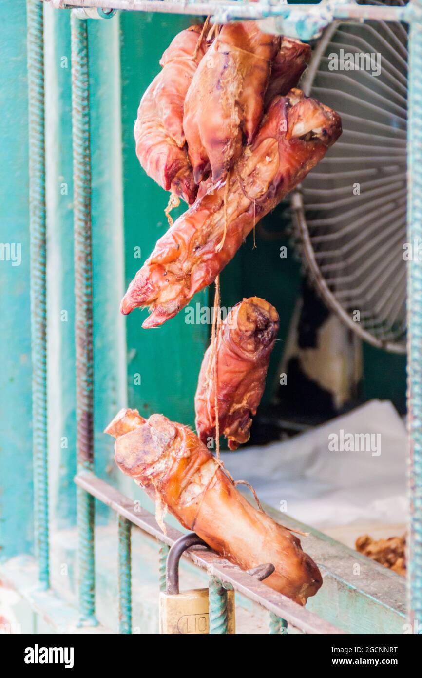 Pig legs hanging on a string in a window in Havana, Cuba Stock Photo ...