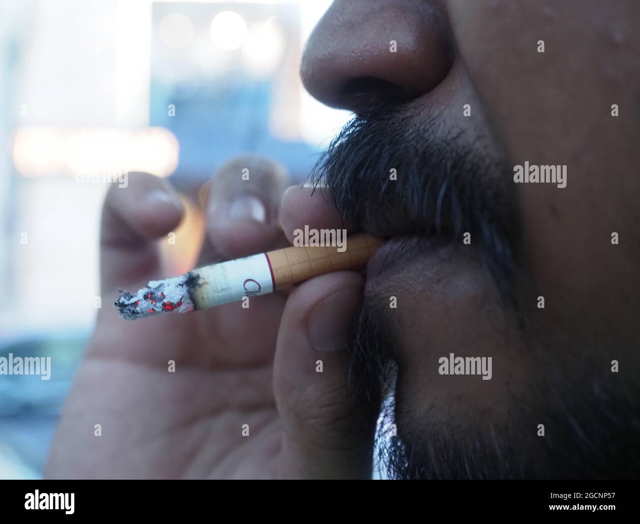 Man smoking cigarette Stock Photo - Alamy