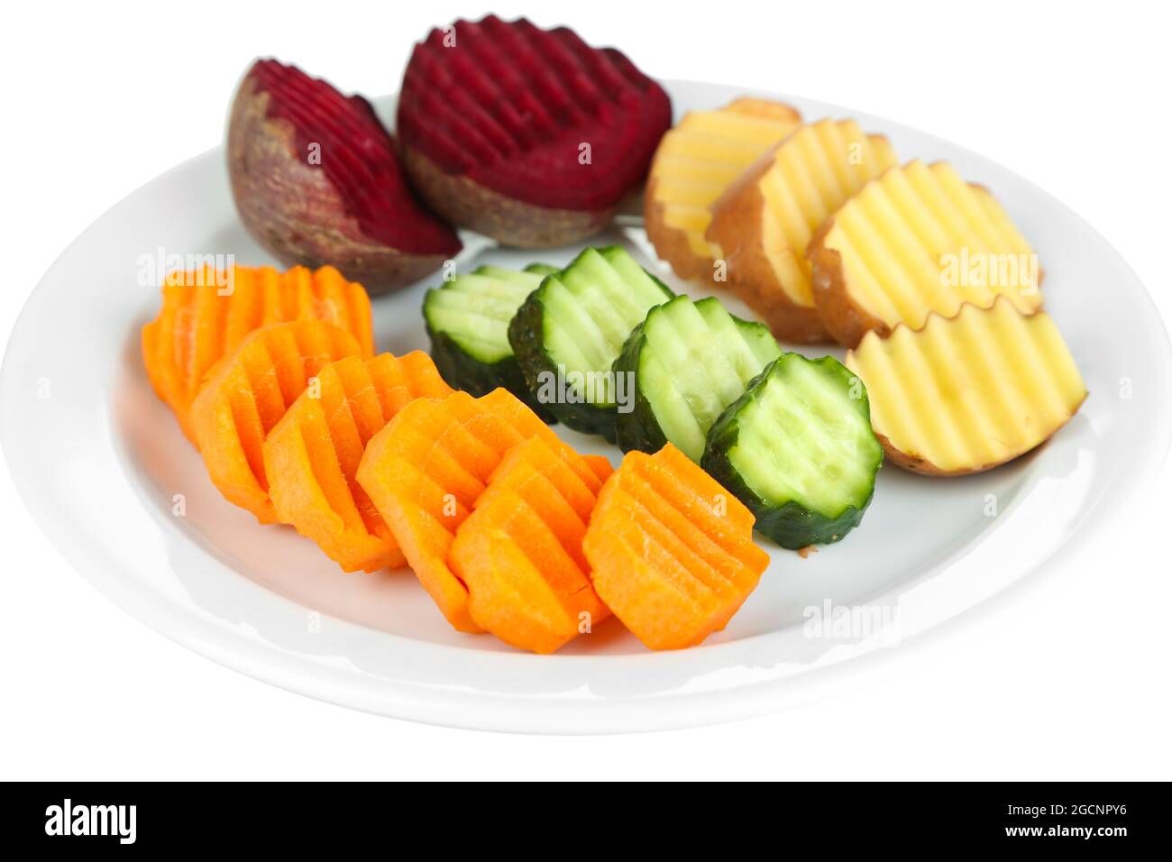 Beautiful sliced vegetables on plate, isolated on white Stock Photo - Alamy